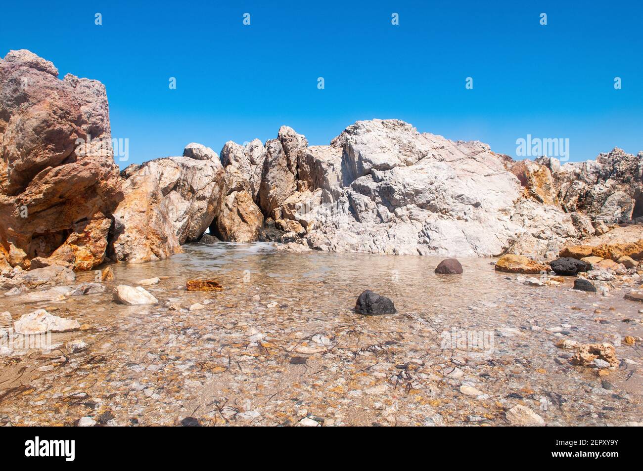Rocky grottoes on a picturesque beach on the Kos island, Greece Stock ...
