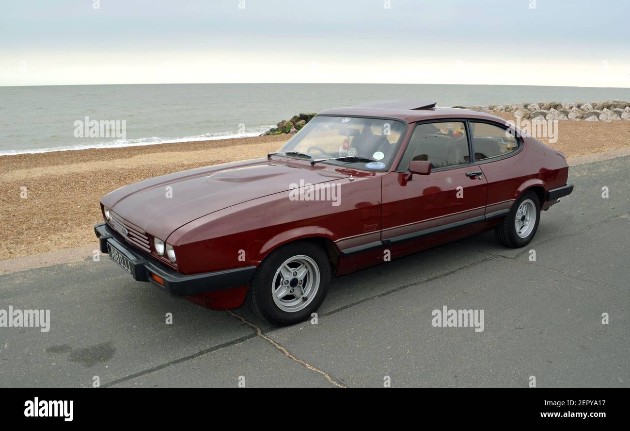 Classic Dark Red Ford Capri Motor Car parked on seafront promenade ...