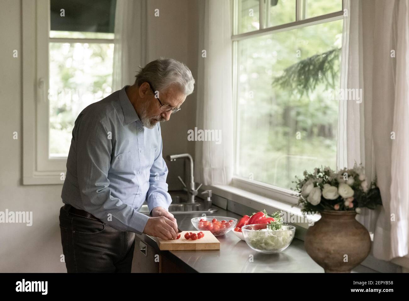 Mature male chef cooking hi-res stock photography and images - Alamy