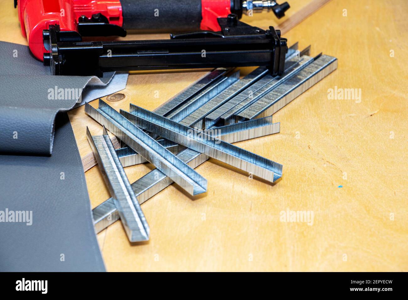 concept of furniture production and repair. Stapler and staples ...