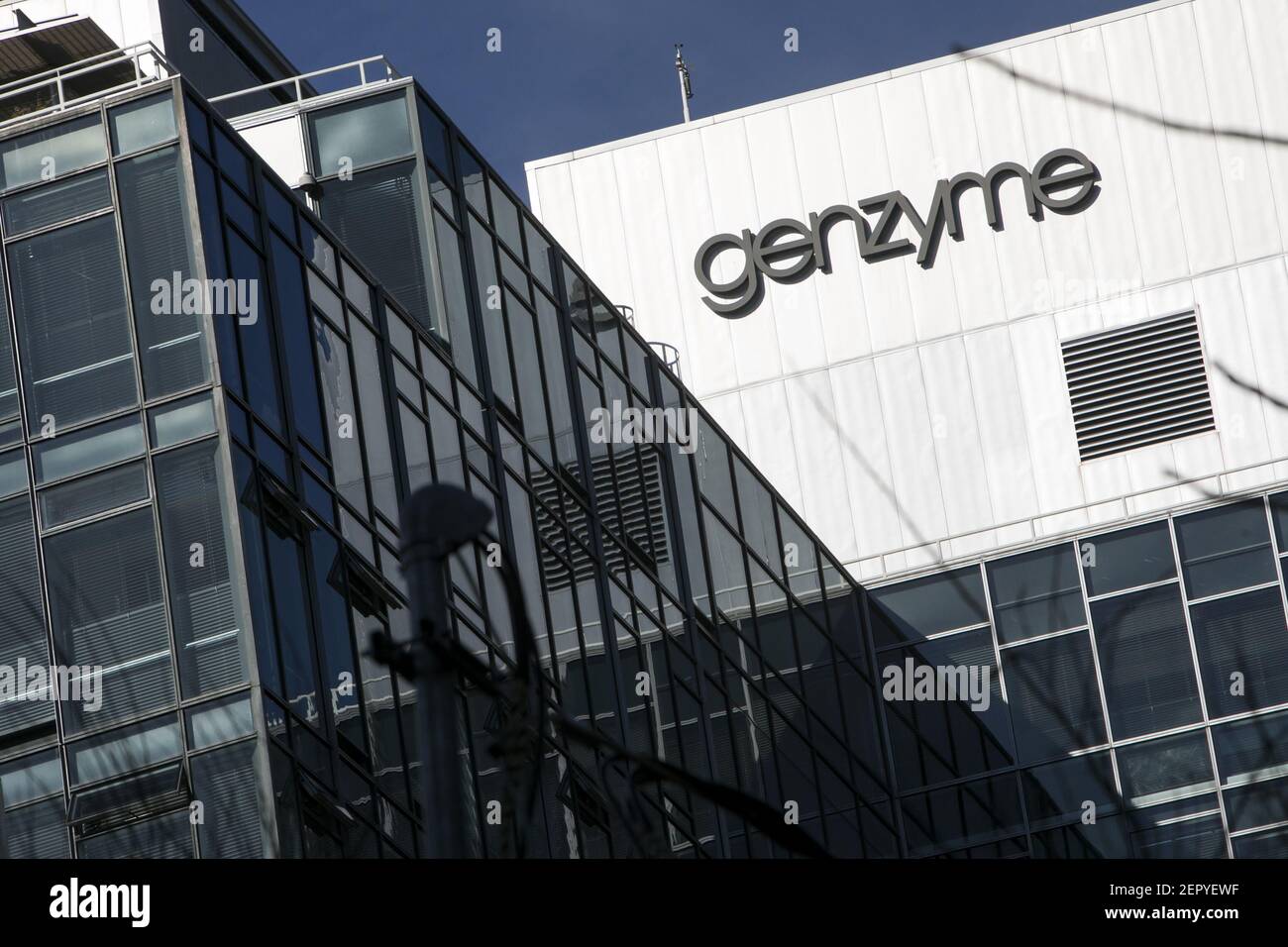 A logo sign outside of the headquarters of Sanofi Genzyme in Cambridge ...