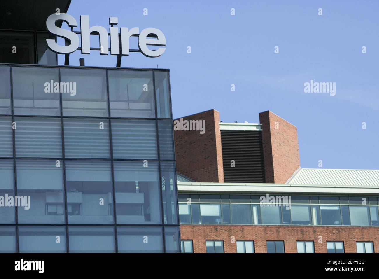 A logo sign outside of a facility occupied by Shire, Plc., in Cambridge ...
