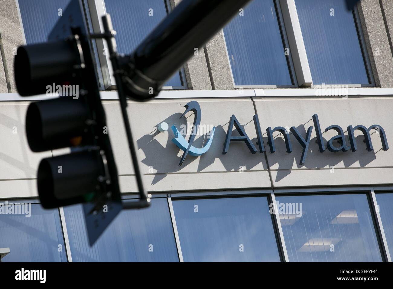 A logo sign outside of the headquarters of Alnylam Pharmaceuticals in ...