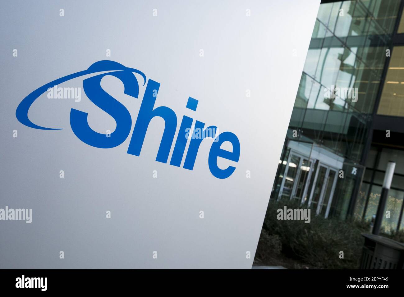 A logo sign outside of a facility occupied by Shire, Plc., in Cambridge ...