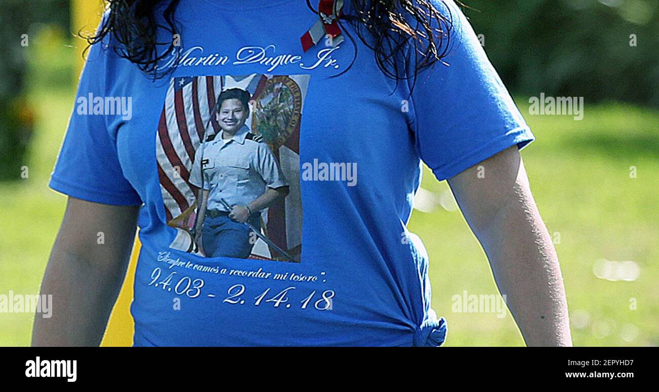 A mourner wears a T-shirt in tribute of Martin Duque, a victim of the ...