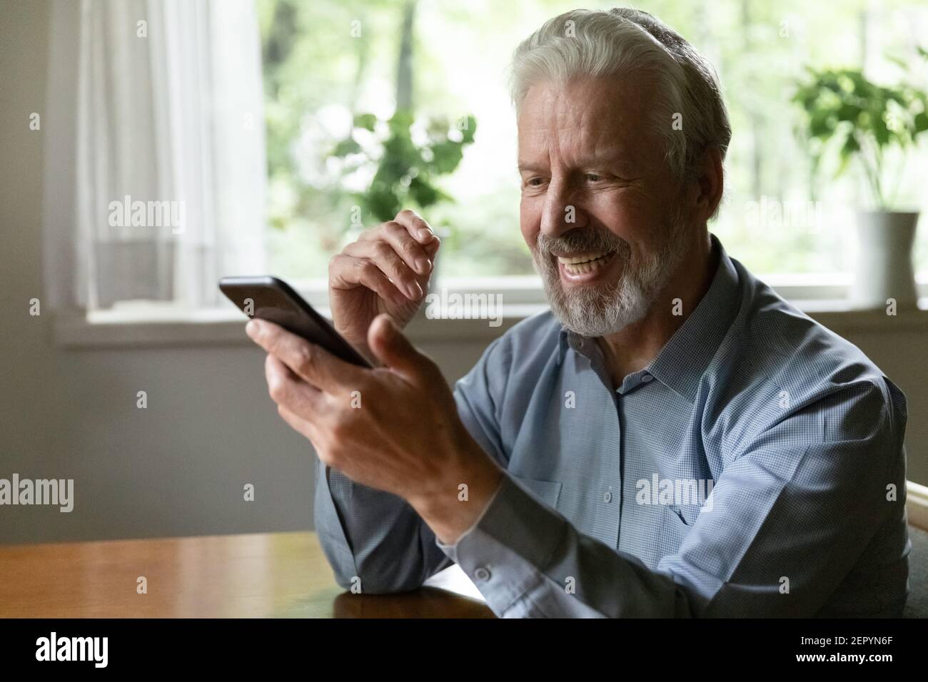 Man laughing making phone hi-res stock photography and images - Alamy