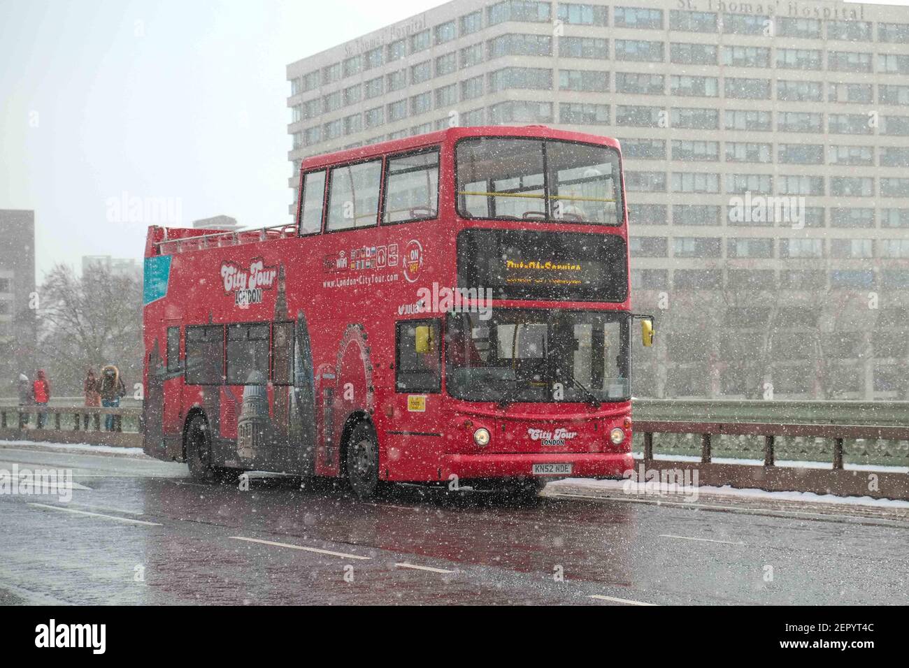 A bus crosses Westminster Bridge in heavy snowfall in London,UK on ...