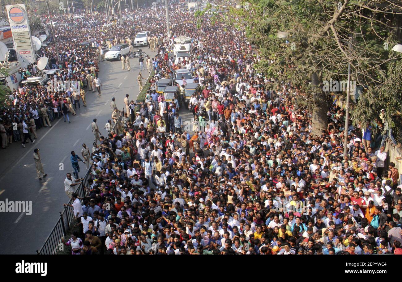 MUMBAI, INDIA - FEBRUARY 28: Crowds gather behind the funeral ...