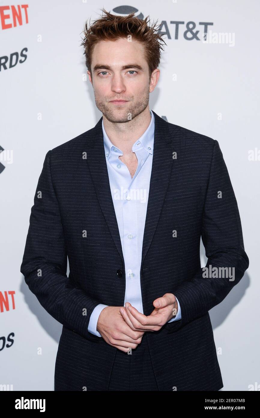 Robert Pattinson walking on the blue carpet during the 33rd Film ...
