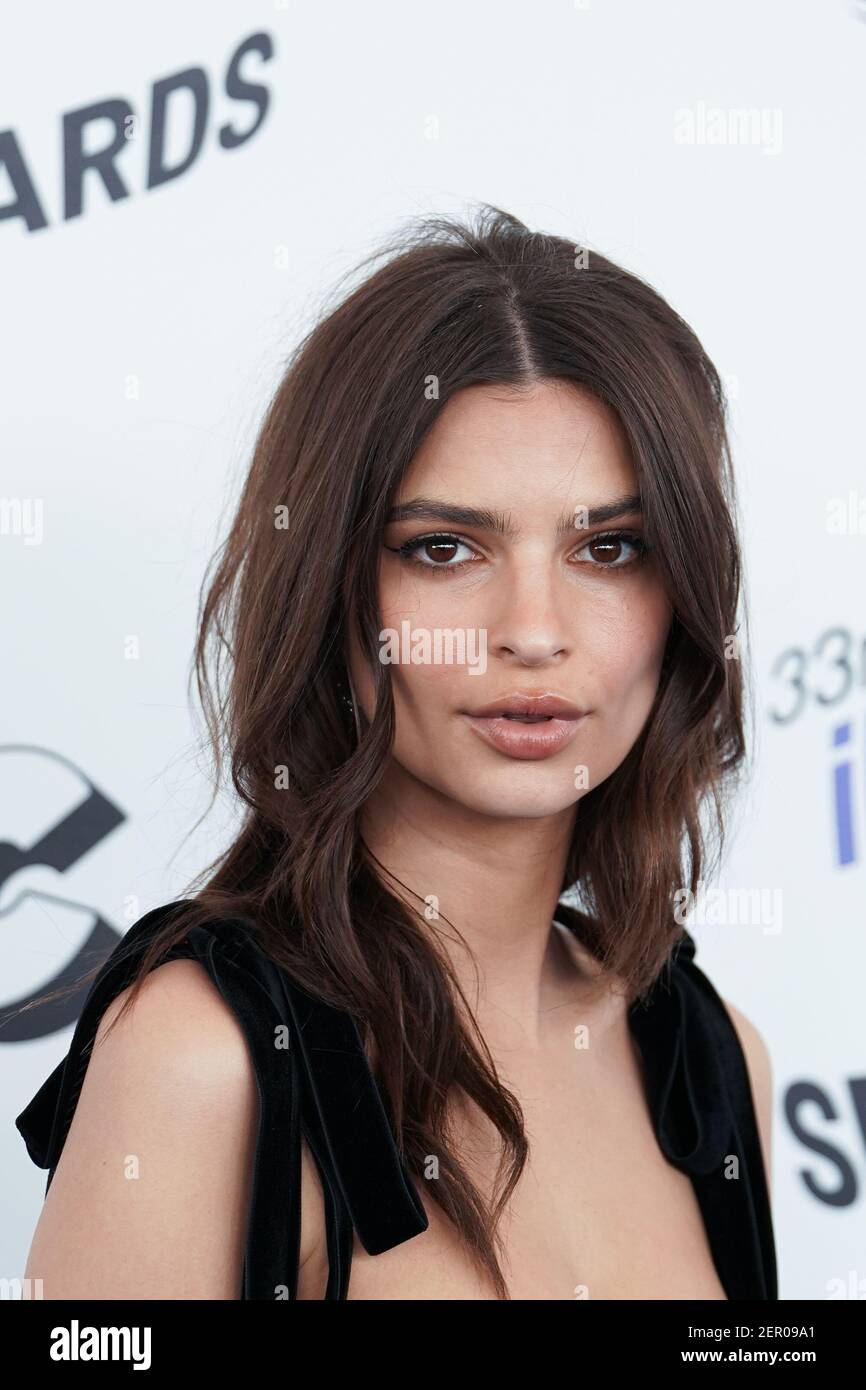 Emily Ratajkowski walking on the blue carpet during the 33rd Film ...