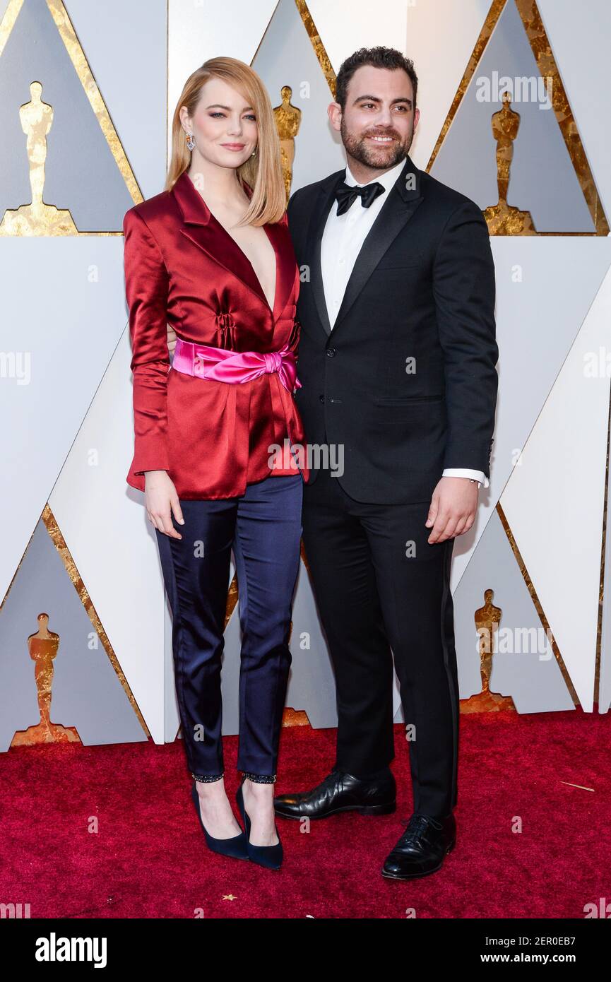 Emma Stone and brother Spencer Stone walking on the red carpet during ...