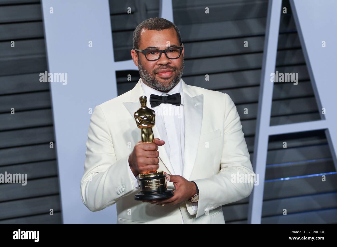 Jordan Peele walking on the red carpet at the 2018 Vanity Fair Oscar ...