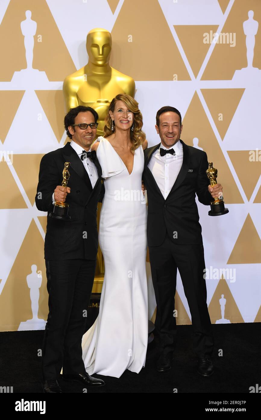 Bryan Fogel, Laura Dern, Dan Cogan in the press room during the 90th ...