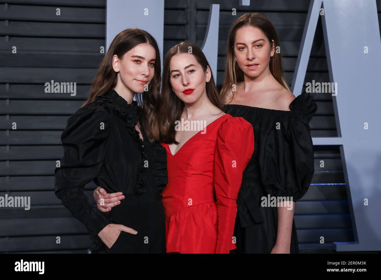 Haim walking on the red carpet at the 2018 Vanity Fair Oscar Party ...