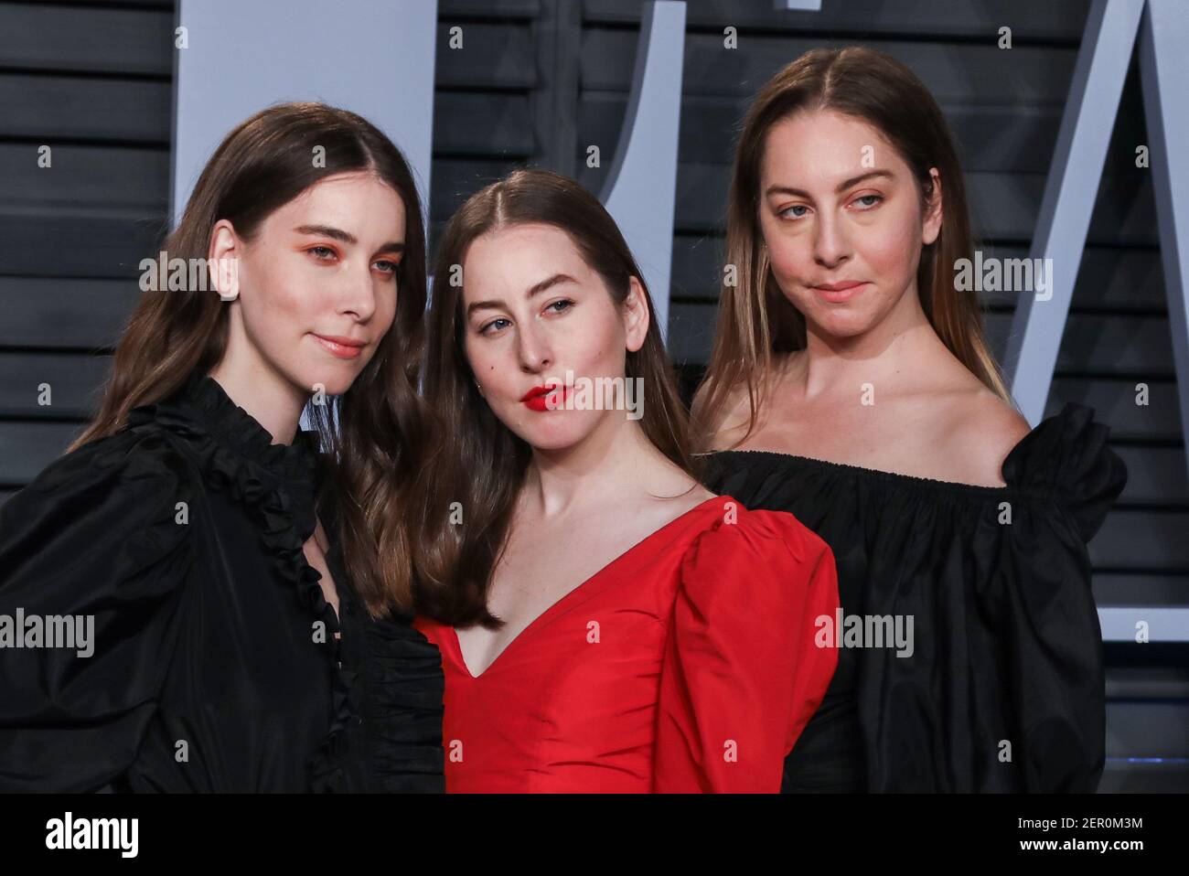 Haim walking on the red carpet at the 2018 Vanity Fair Oscar Party ...