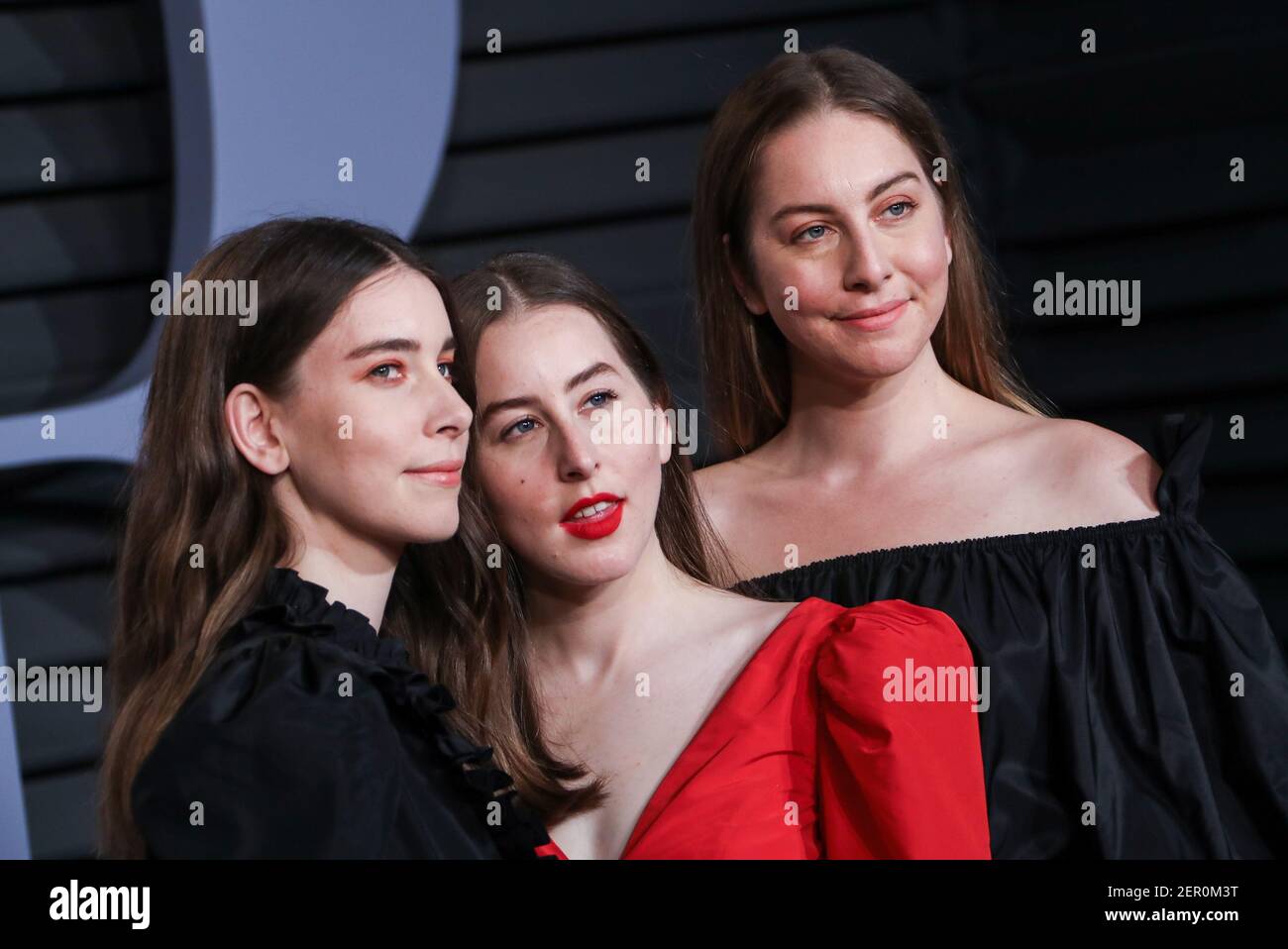 Haim walking on the red carpet at the 2018 Vanity Fair Oscar Party ...