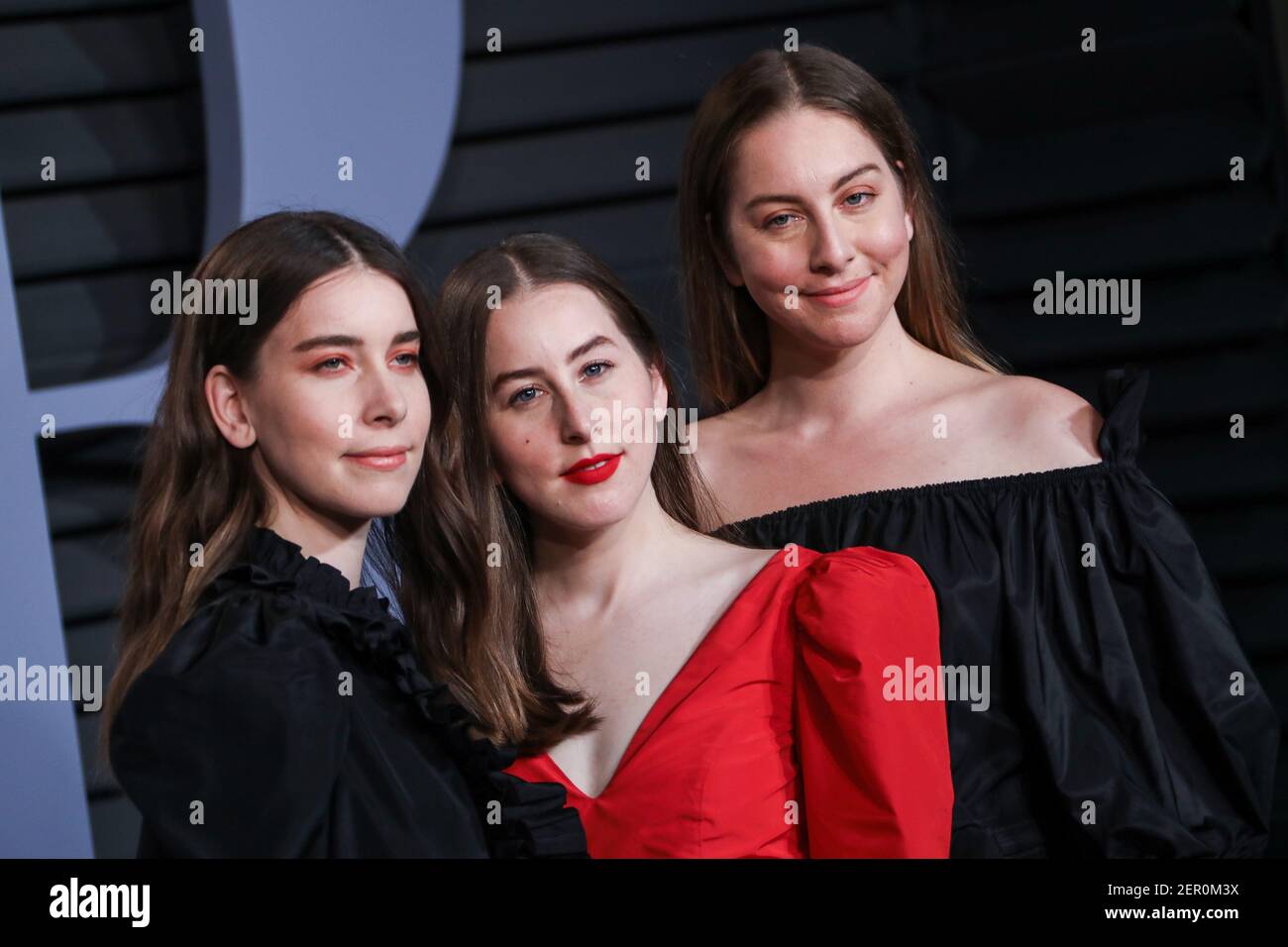 Haim walking on the red carpet at the 2018 Vanity Fair Oscar Party ...