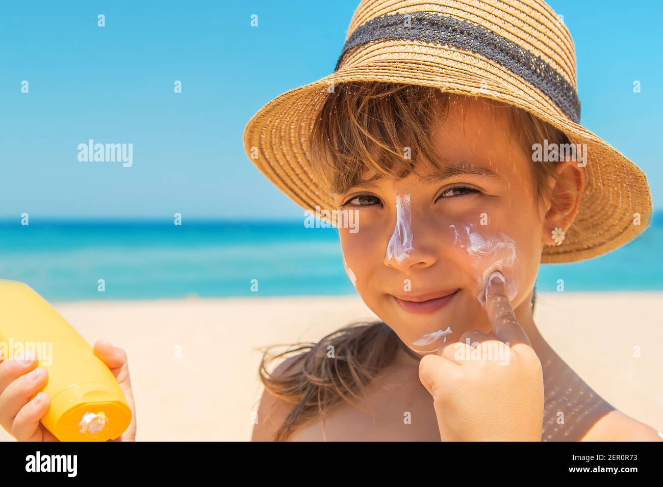 Sunscreen on the skin of a child. Selective focus. nature Stock Photo ...