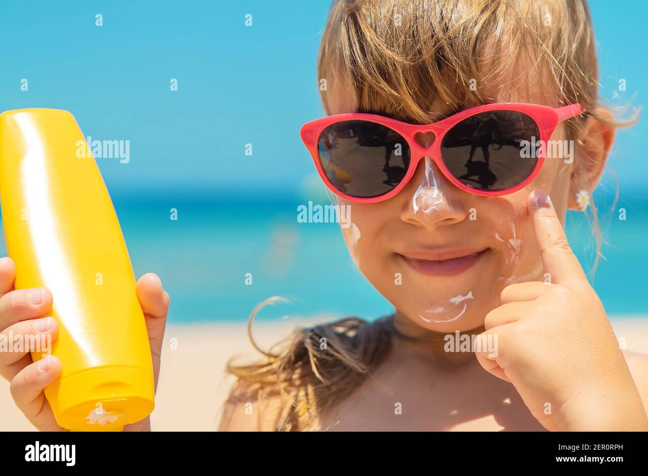 Sunscreen on the skin of a child. Selective focus. nature Stock Photo ...