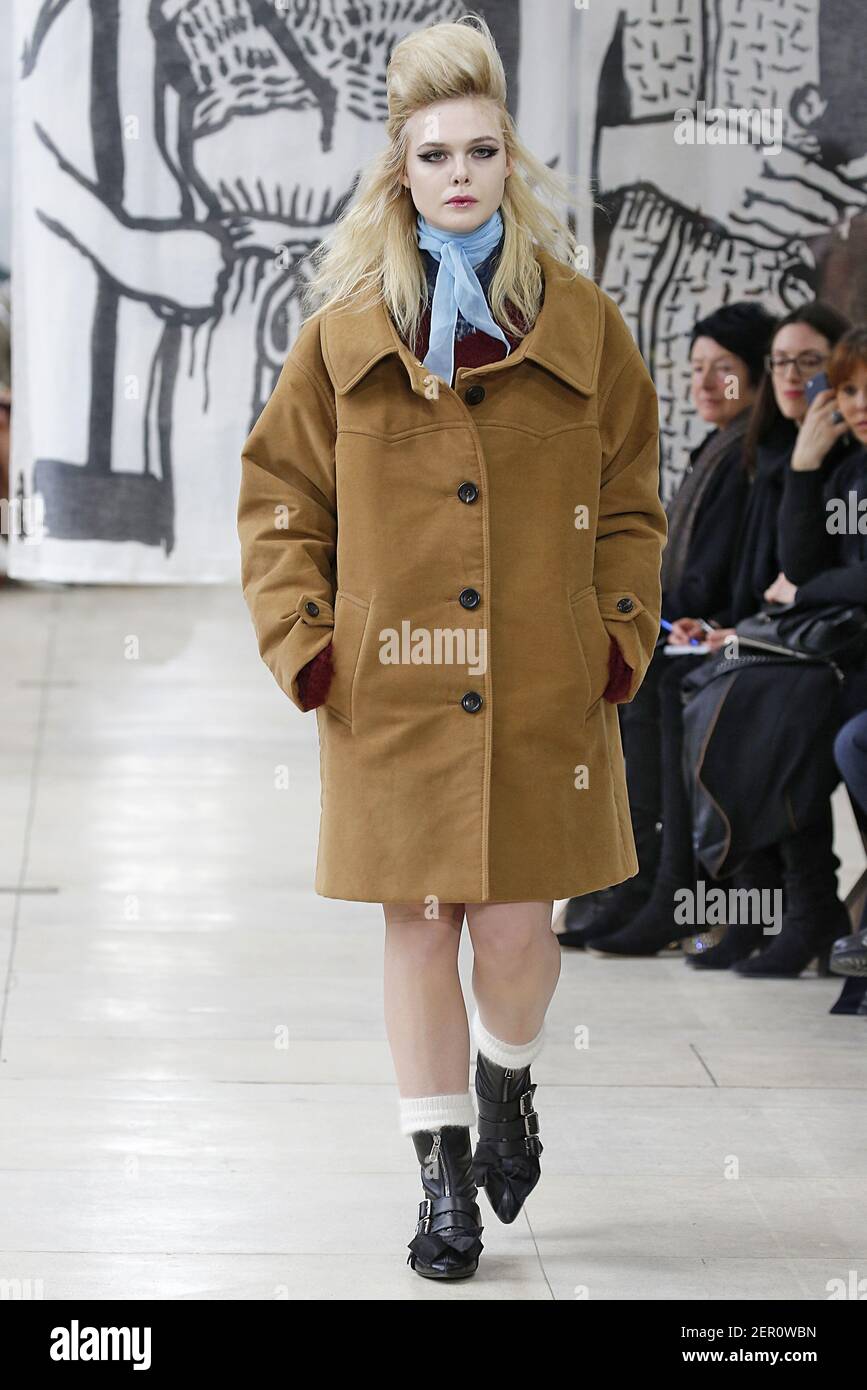 Model Elle Fanning walks on the runway during the Miu Miu Fashion Show ...