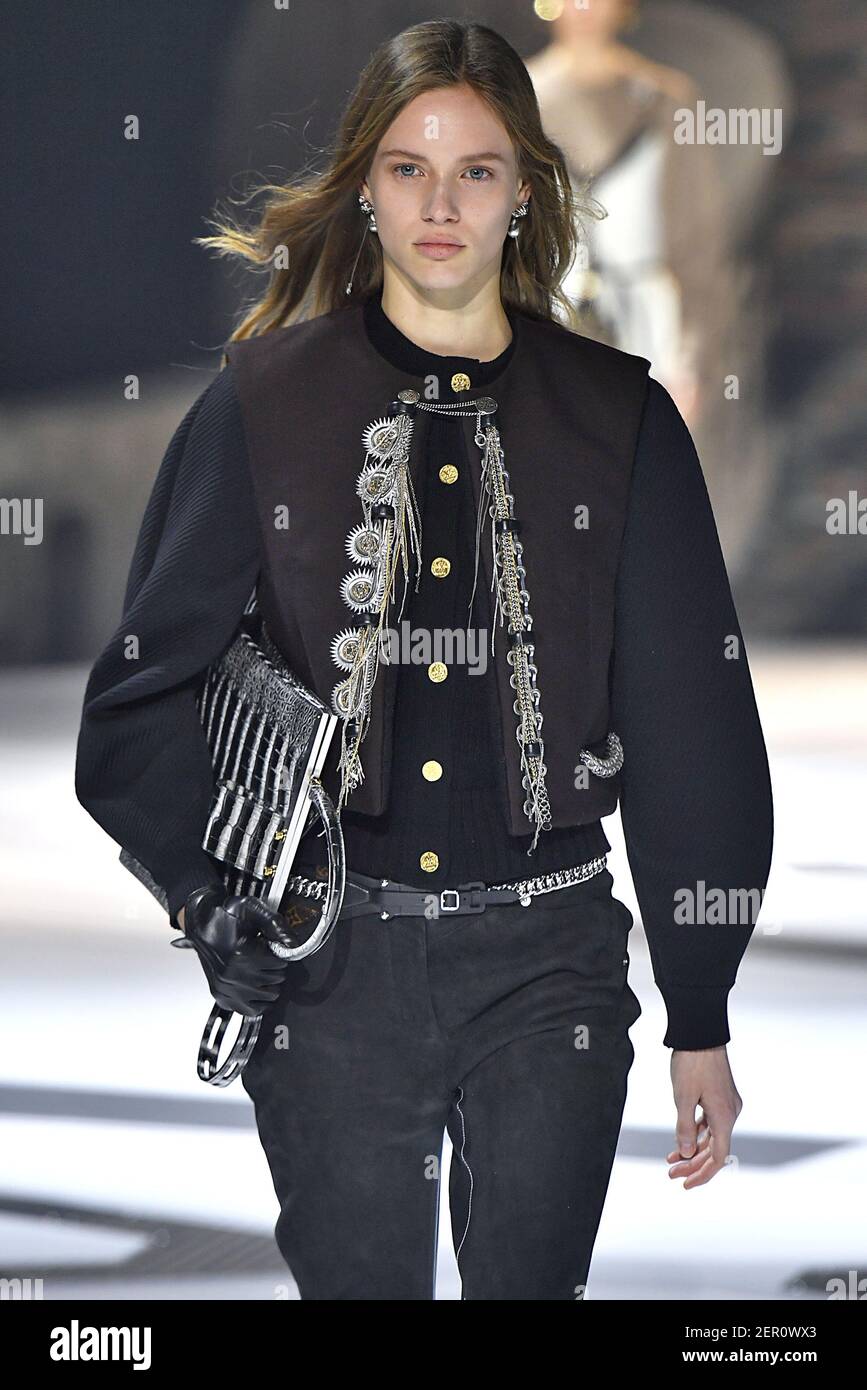 Model Sara Grace Wallerstedt walks on the runway during the Louis ...