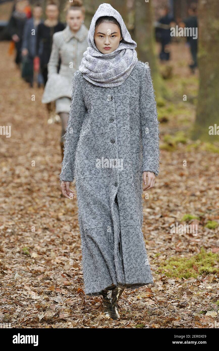 Model He Cong walks on the runway during the Chanel Fashion Show during ...