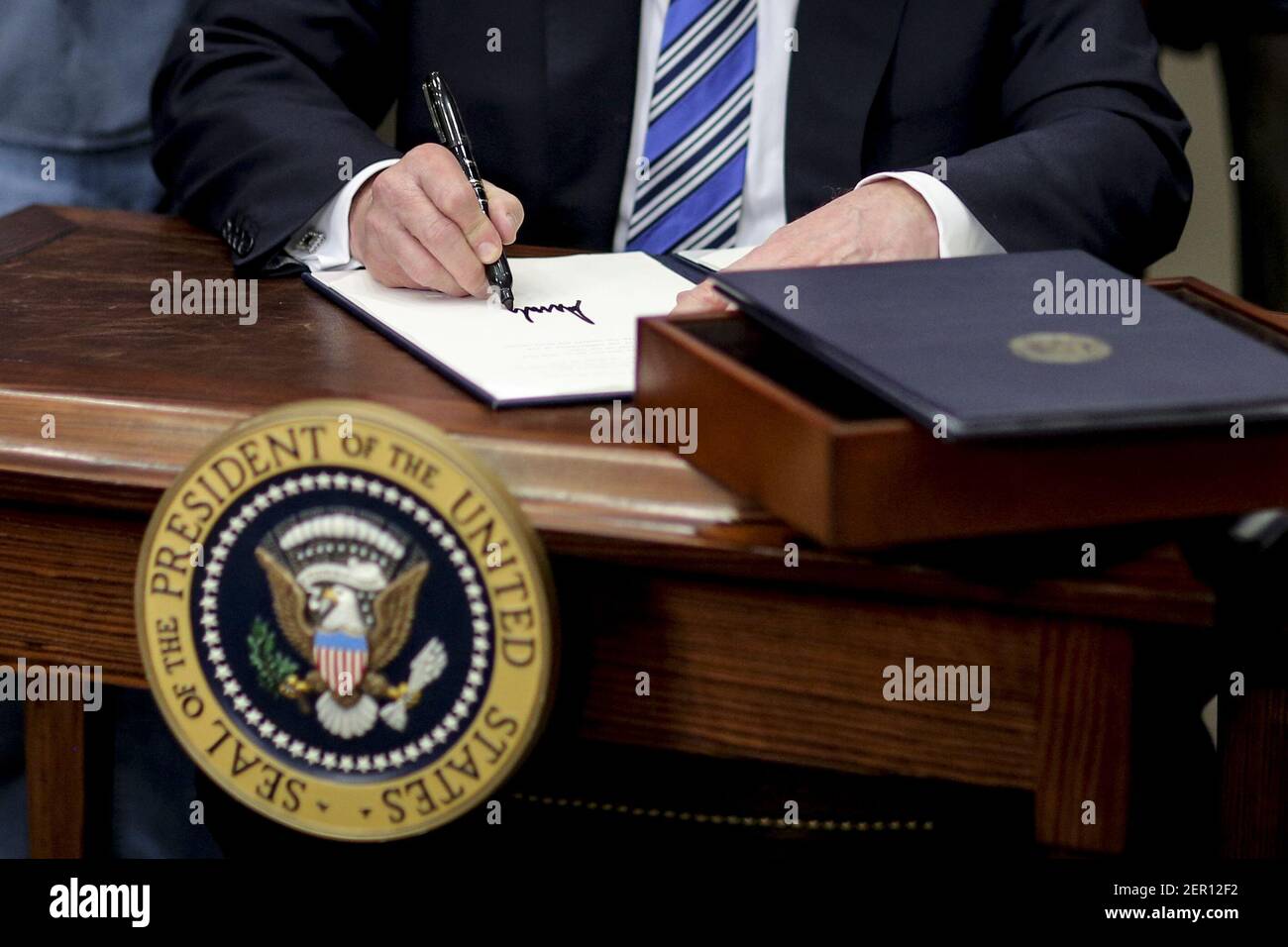 President Donald Trump, signs the 'Section 232 Proclamations' to ...