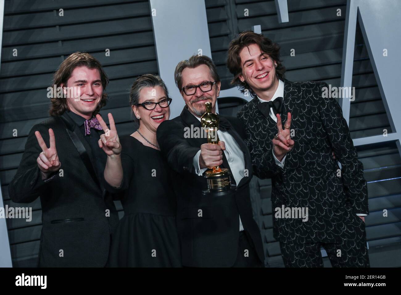 Charlie John Oldman, Gisele Schmidt, Gary Oldman and Gulliver Flynn ...