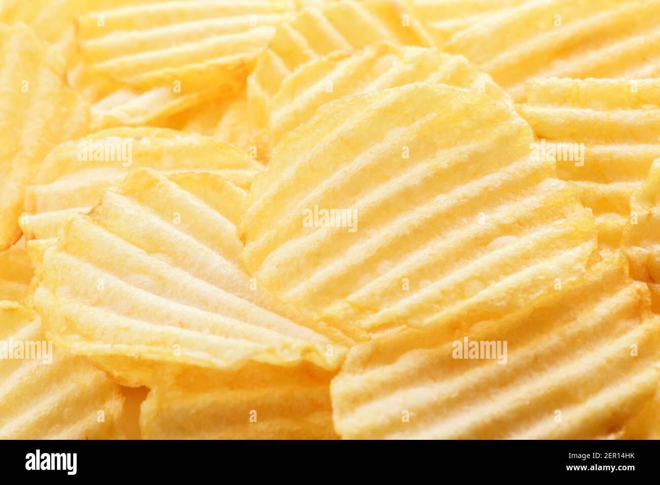 Potato chips pattern. Yellow corrugated salted potato chips as food ...