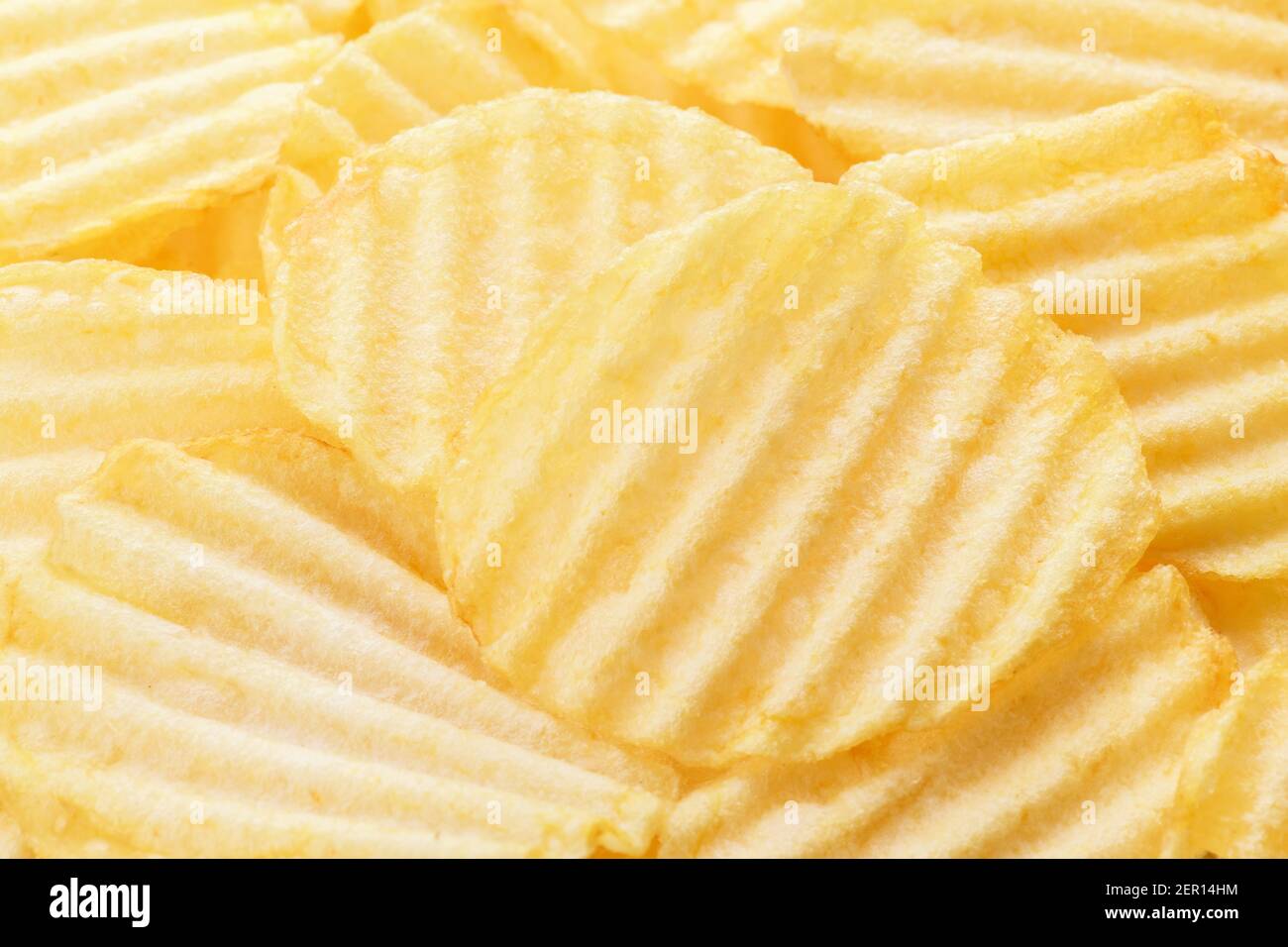 Potato chips pattern. Yellow corrugated salted potato chips as food ...