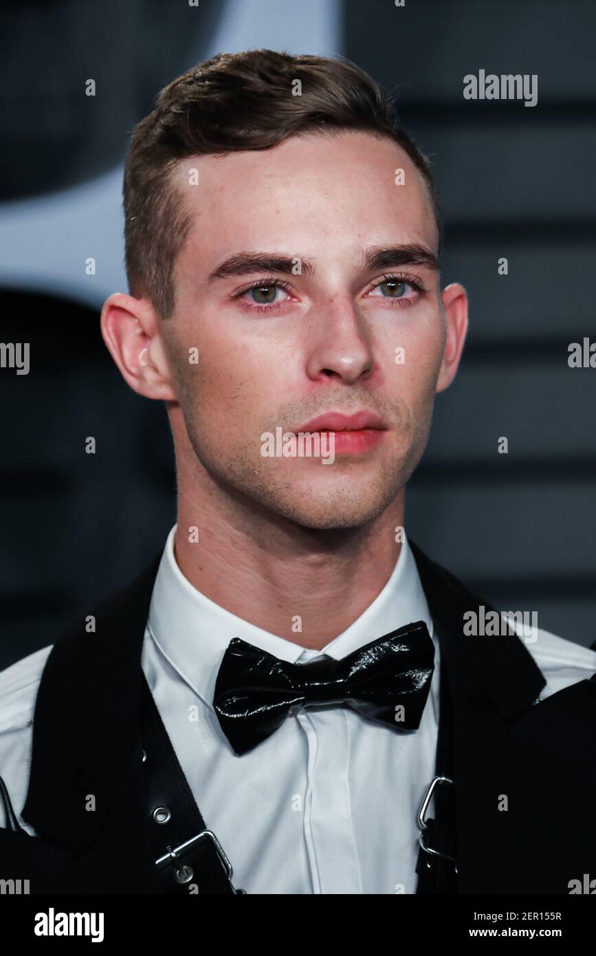Adam Rippon walking on the red carpet at the 2018 Vanity Fair Oscar ...