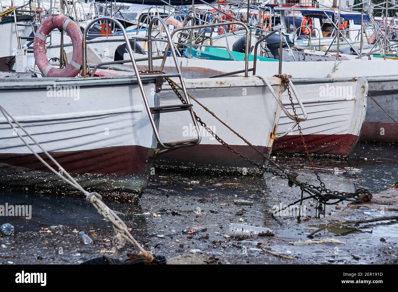 environmental pollution - extremely dirty water between moored ships in ...