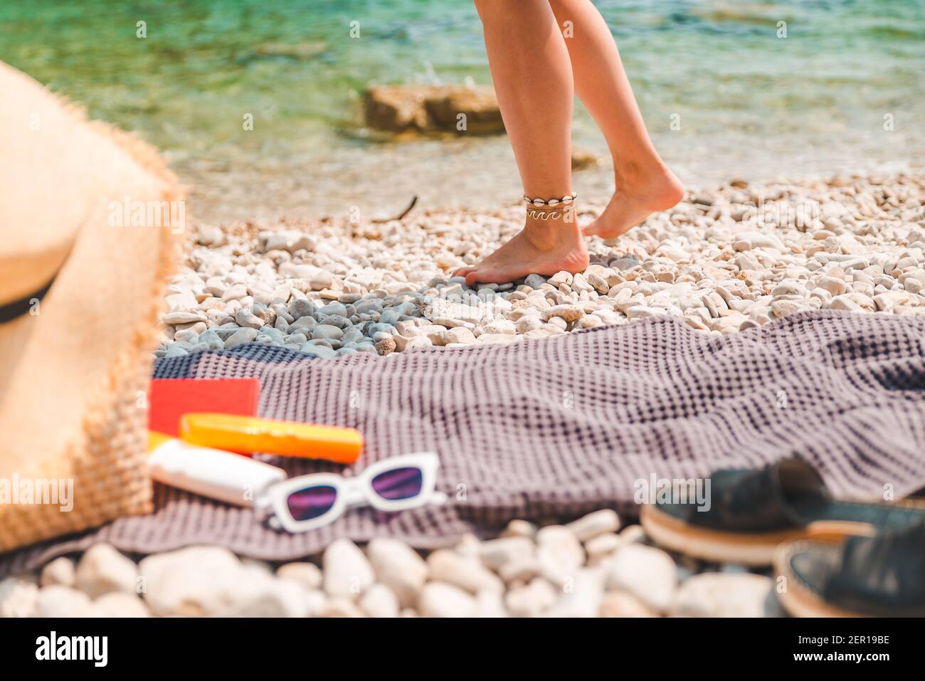 sea stuff at blanket at rocky beach copy space Stock Photo - Alamy