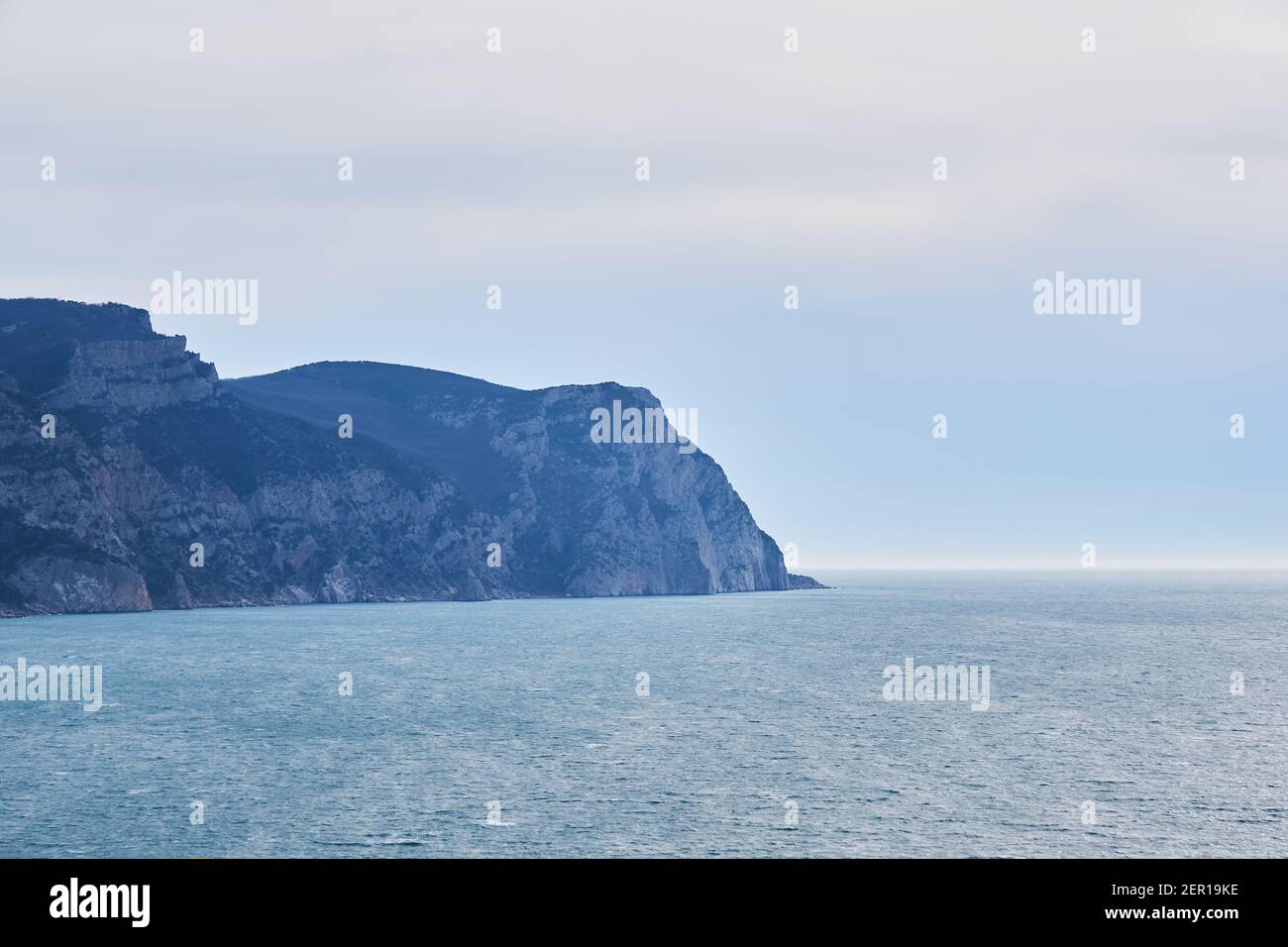 view of the winter sea with a high coastal cliff Stock Photo - Alamy