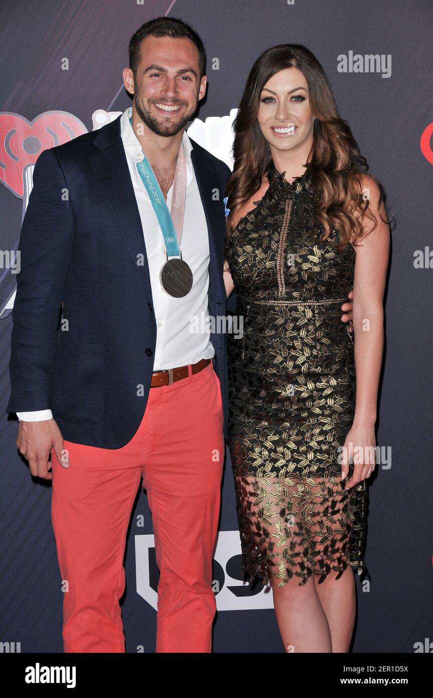 Chris Mazdzer (L) and Mara Marian at the 2018 iHeartRadio Music Awards ...