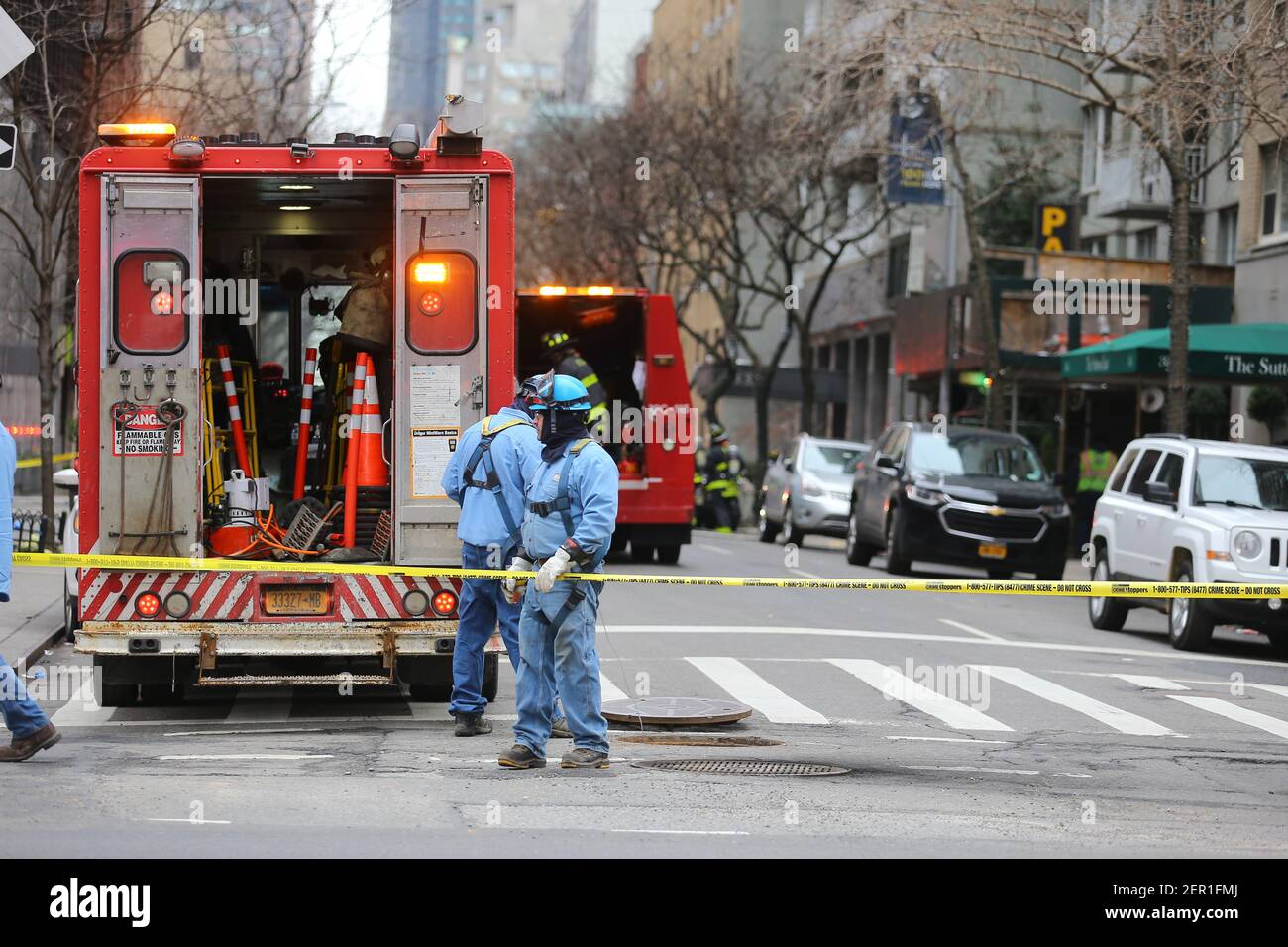 First responders and crowds gather at a manhole explosion in midtown ...