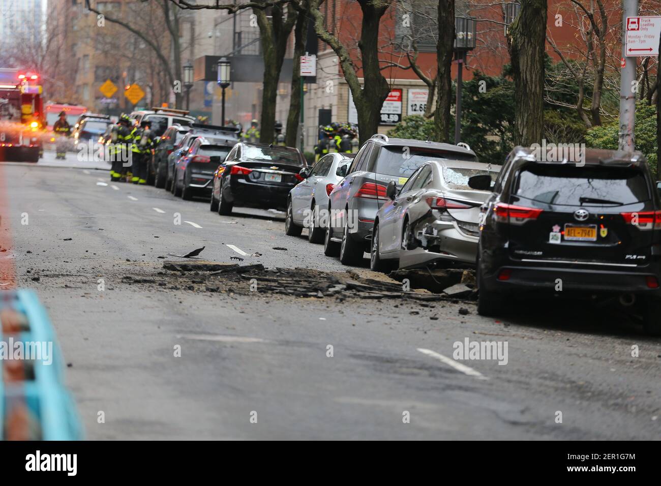 First responders and crowds gather at a manhole explosion in midtown ...
