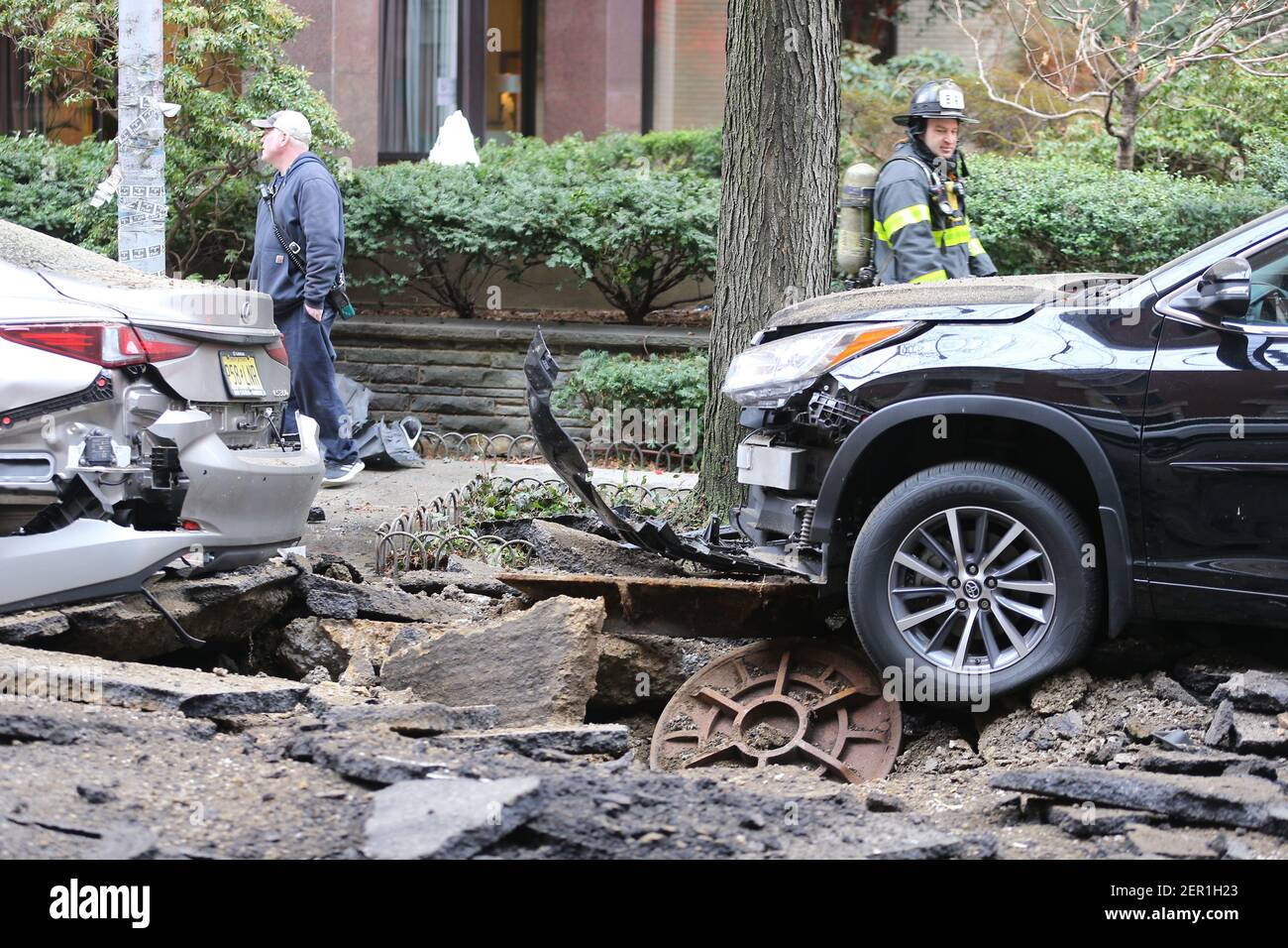 First responders and crowds gather at a manhole explosion in midtown ...