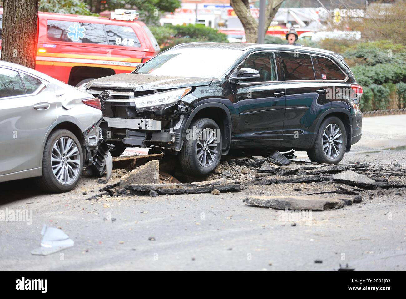 First responders and crowds gather at a manhole explosion in midtown ...