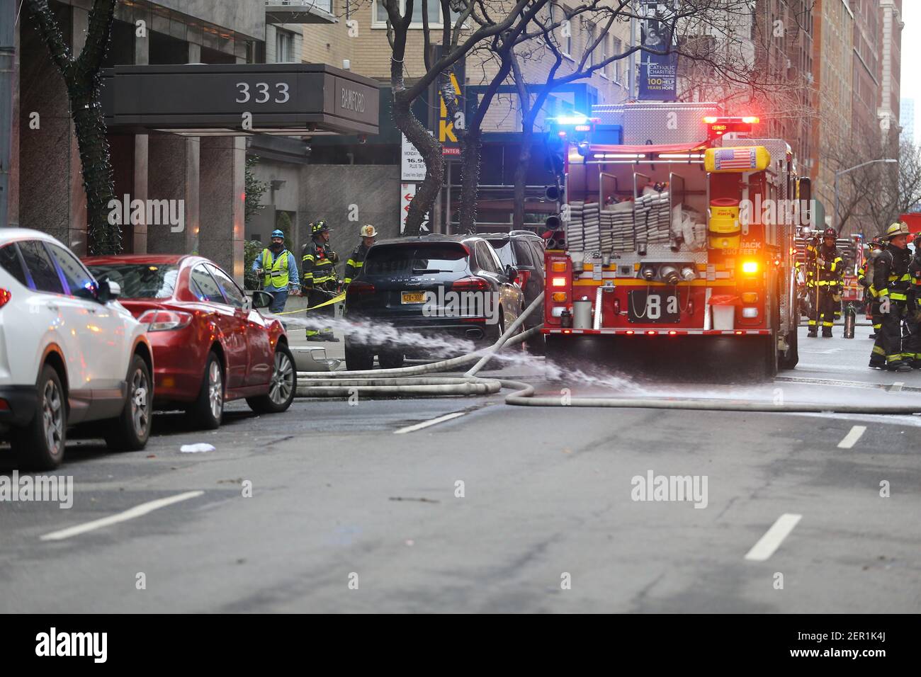 First responders and crowds gather at a manhole explosion in midtown ...
