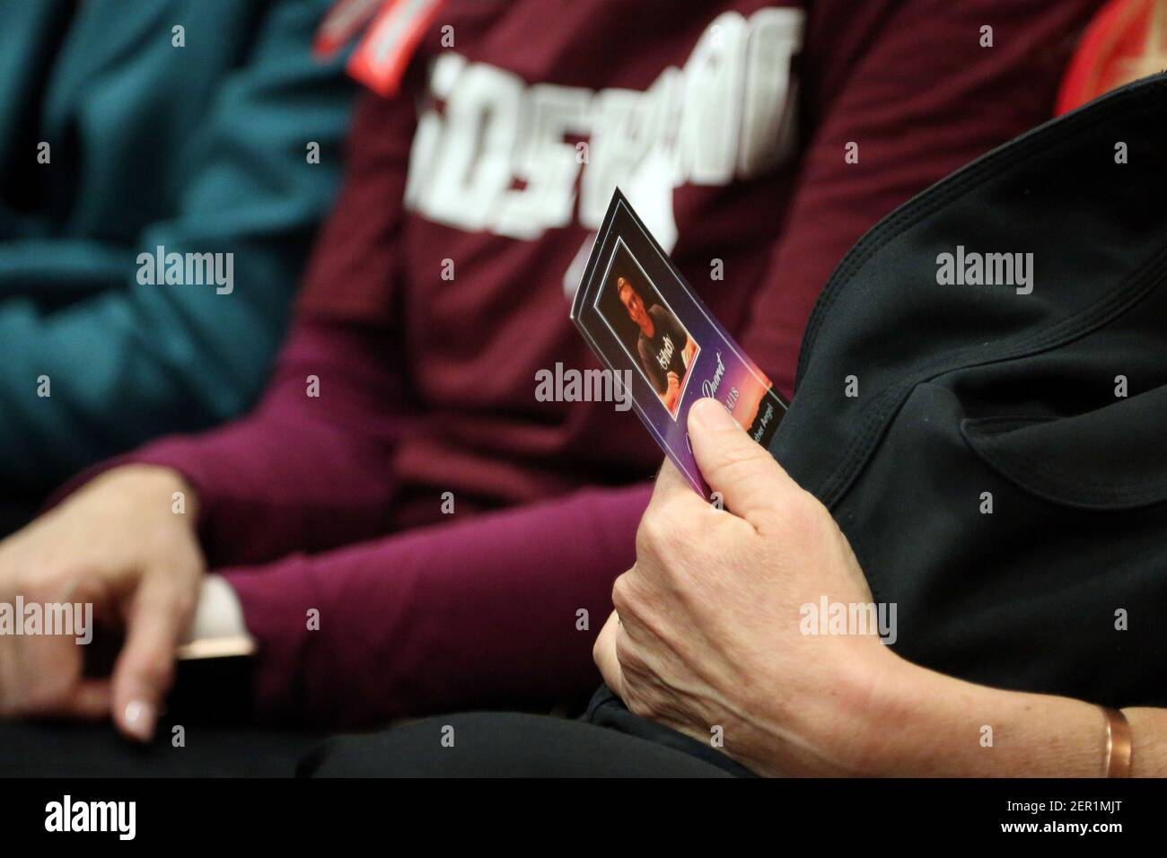 Family of shooting victim Nicholas Dworet hold his prayer card during ...