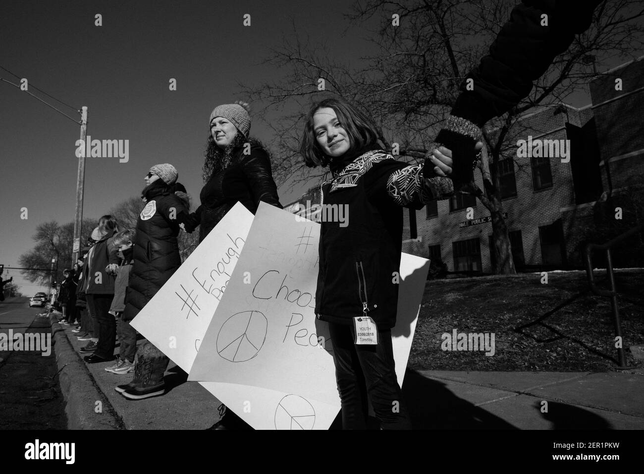 Audrey Back, age 8, holds hands with her mom Nicole Starks outside Hale ...