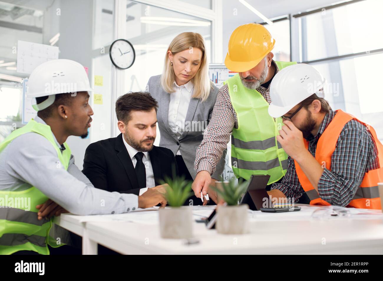 Creative multi ethnic team planning construction project Stock Photo ...