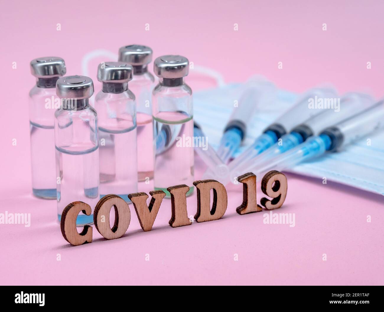 Prevention of seasonal diseases. Medical ampoules, syringes and a mask ...