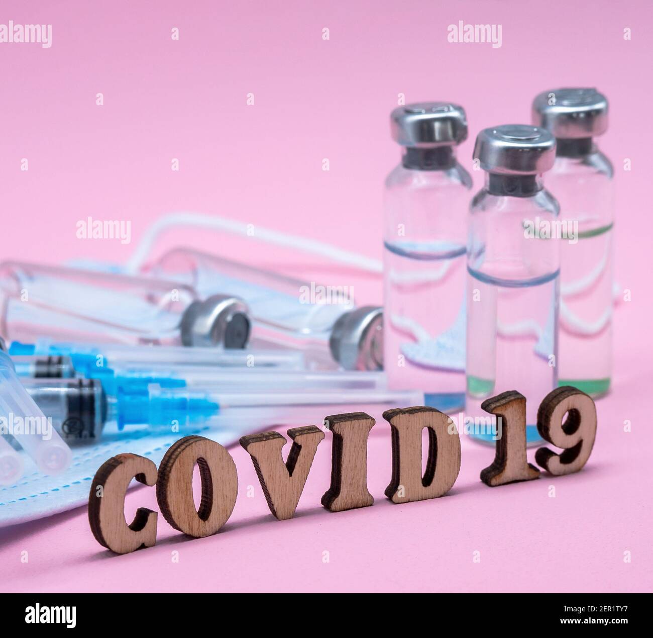 Prevention of seasonal diseases. Medical ampoules, syringes, and a mask ...