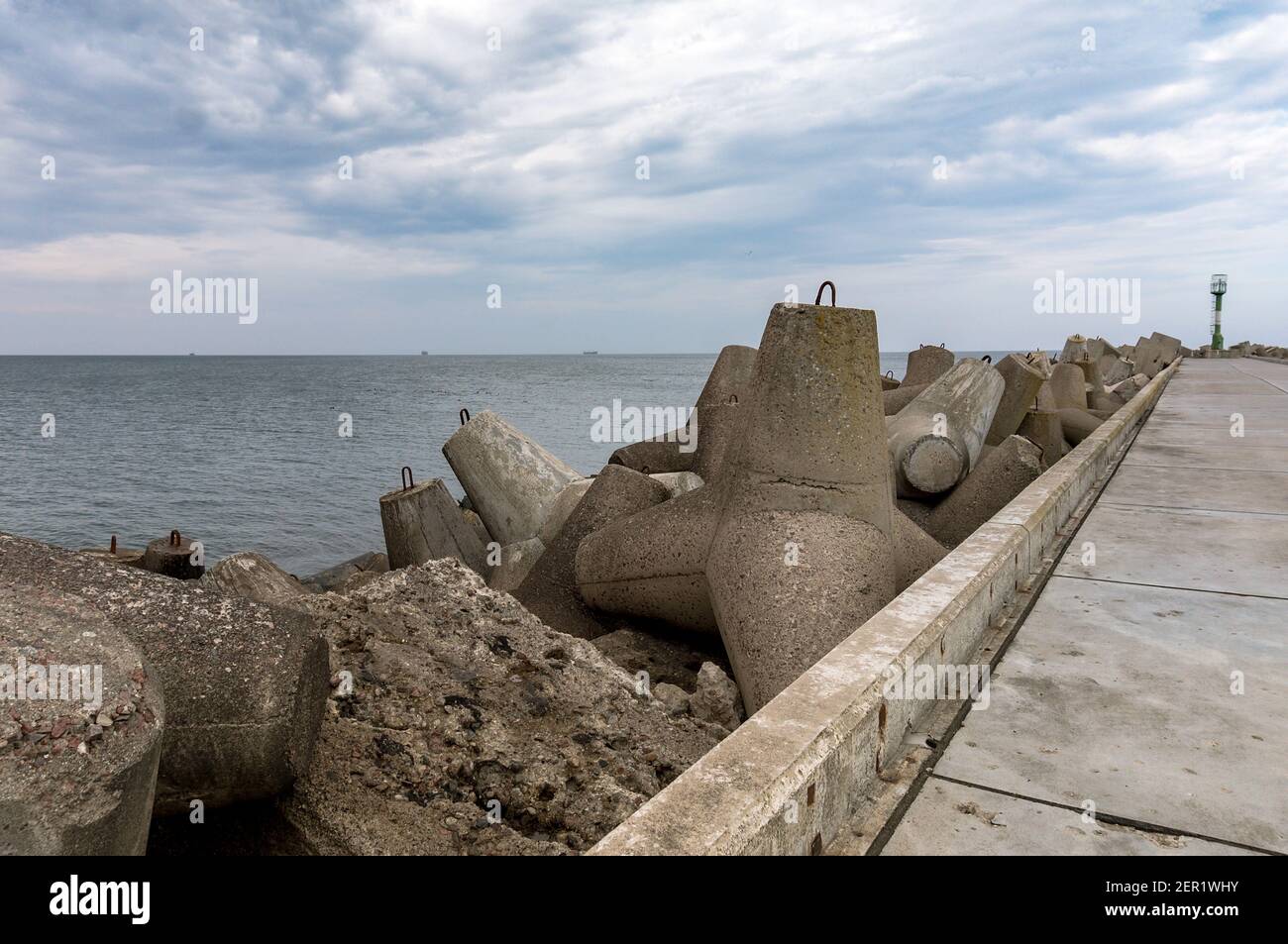 Reinforced concrete structures along the sea pier. Coastal concrete ...