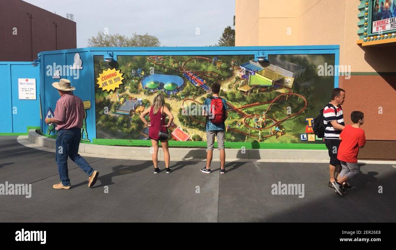 Visitors to Disney's Hollywood Studios look at a map of Toy Story Land ...