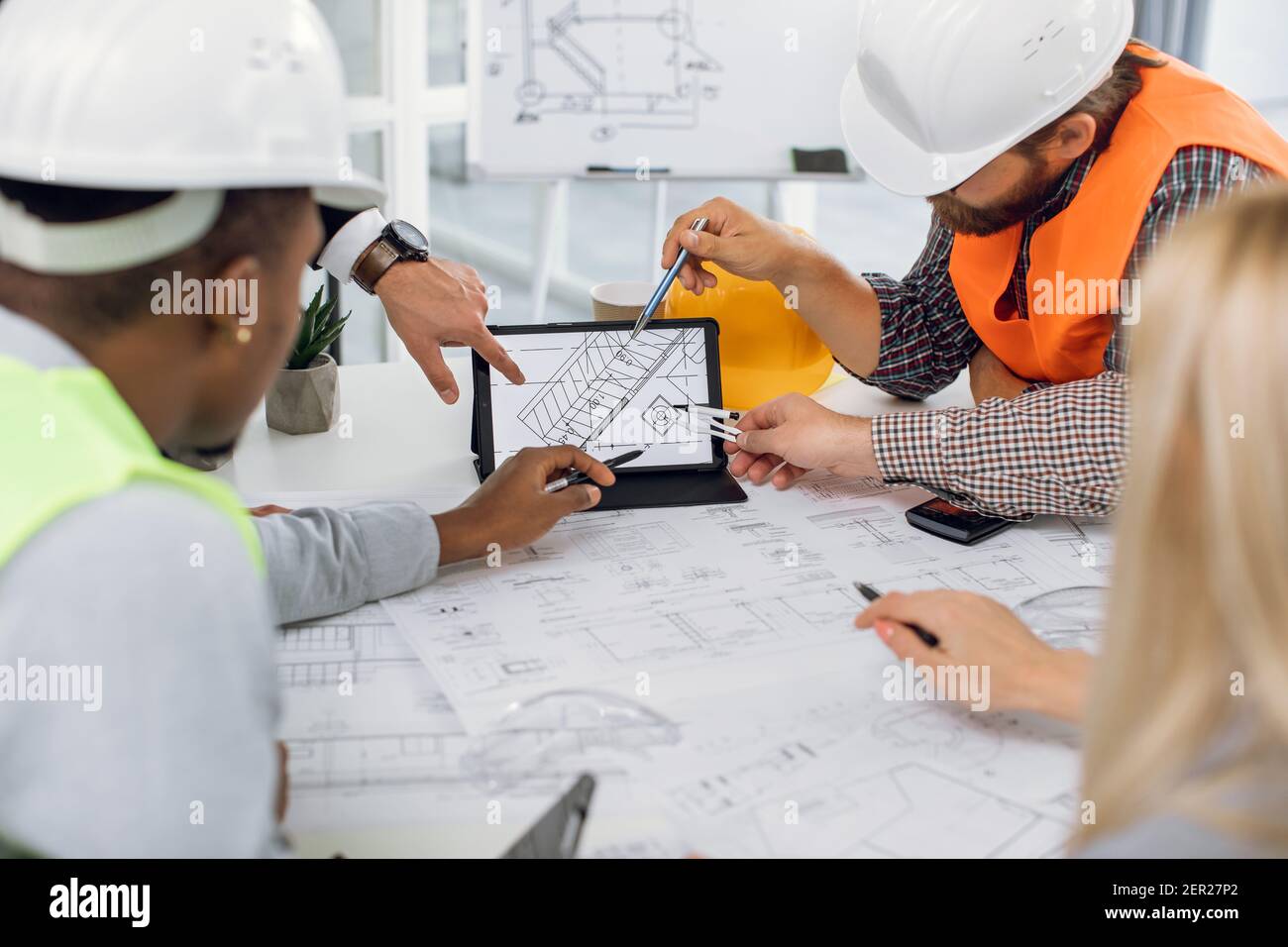 Analysing blueprints hi-res stock photography and images - Alamy