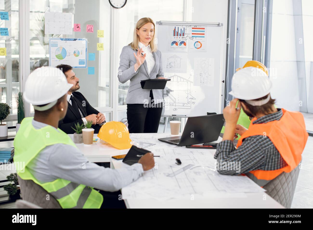 Construction team having discussion during meeting Stock Photo - Alamy