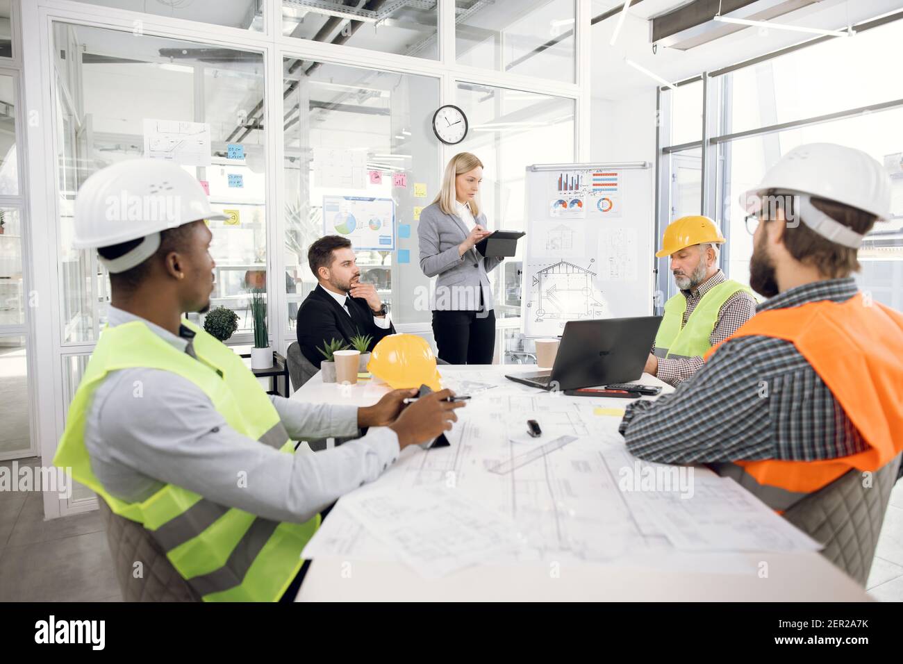Business people discussing project plan in details Stock Photo - Alamy